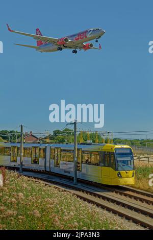 Manchester Metrolink tram approaching the Manchester Airport station ...
