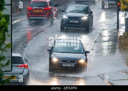 Chippenham, UK, 16th August, 2022. Drivers are pictured braving very ...