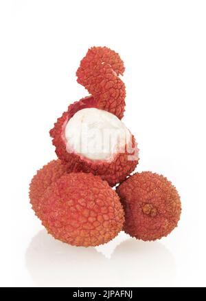 Isolated lychees. One whole ripe litchi fruit isolate on white ...