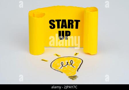 Start up creative concept, inscription on yellow cubes Stock Photo - Alamy