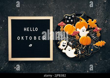 Sugar cookies for Hallween with black board for text on dark background ...