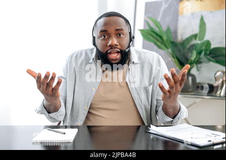 confused guy has online video communication outdoor. guy has online ...