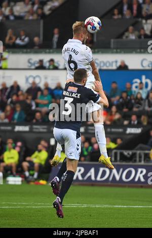 Harry Darling #6 of Swansea City headers at goal Under pressure from ...
