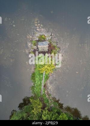 An aerial view of a hut on an islet Stock Photo - Alamy
