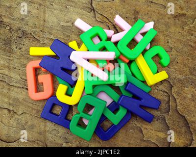Multi color alphabet letter isolated on stone background Stock Photo ...