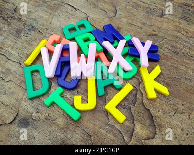 Multi color alphabet letter isolated on stone background Stock Photo ...