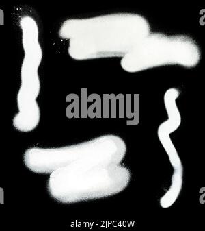 Close-up of four black spray paint lines and shapes, isolated on white ...