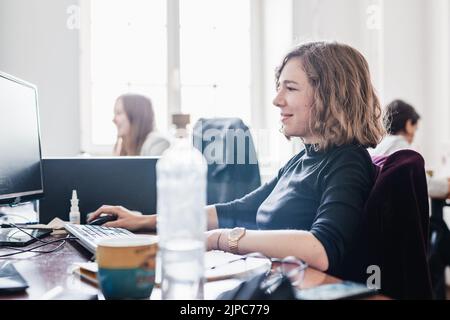 Team of developers working on new software, first person view Stock ...