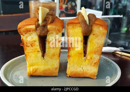 Bread Toast at Malacca Toast Cafe, Jakarta, Indonesia Stock Photo - Alamy
