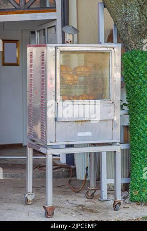 Commercial Chicken Rotisserie Roasting Machine in Front of Restaurant ...