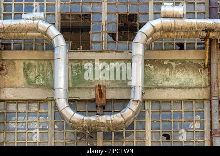 U Shape Bend Steam Pipe Line in Old Factory Stock Photo - Alamy