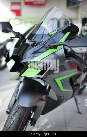 Kawasaki ZX10R Motorcycle from the left side, resting on the stand and ...