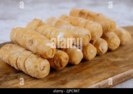 Fried tequeños, fingers stuffed with salty artisanal cheese, typical ...