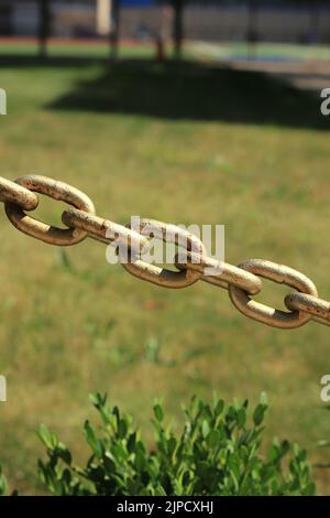 A taught rope of iron metal chain links with lots of holding power ...