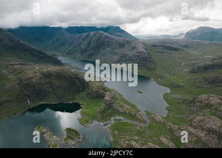 A beautiful aerial view of Loch Coruisk with rocks at the seashore ...