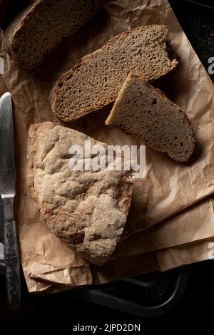 Low key food photography. Black rustic bread on dark background Stock ...