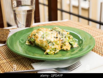 wholesome breakfast. omelet with broccoli on green plate Stock Photo ...