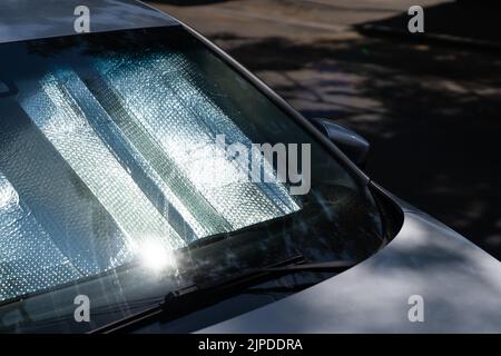 Protective reflective surface under the windshield of the passenger car ...