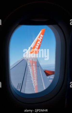 Jet Plane Wing from Cabin Window in Flight Stock Photo - Alamy