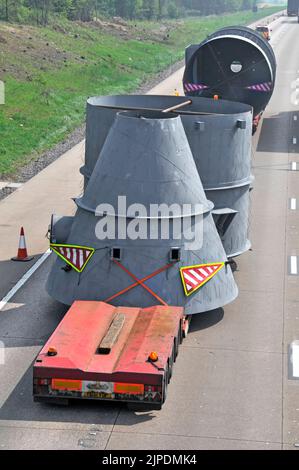 Rear view of oversize load transport of a LNG storage tank approaching ...