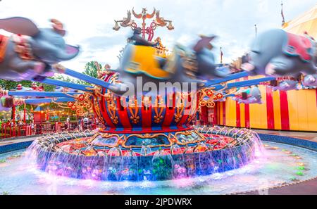 Amusement park ride named Dumbo The Flying Elephant Stock Photo - Alamy
