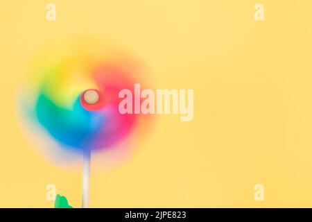 Moving coloured pinwheel on yellow background. Thematic lgtbq Stock ...
