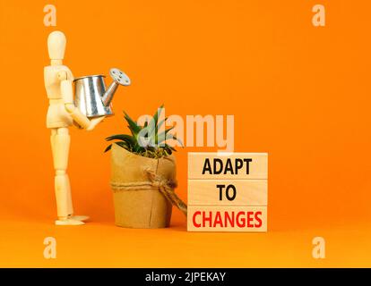 Adapt to changes symbol. Concept words Adapt to changes on wooden ...