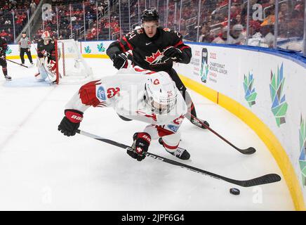 Canada's Ethan Del Mastro (24) and Lukas Cormier (6) defend against ...
