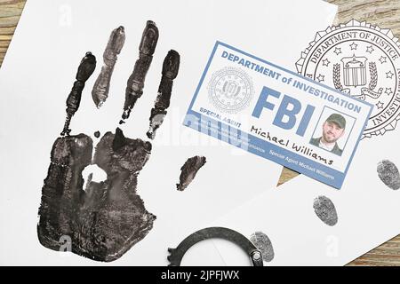 Paper sheets with different prints, document of FBI agent and ...