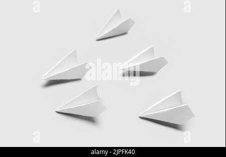 Paper planes on grey background Stock Photo - Alamy