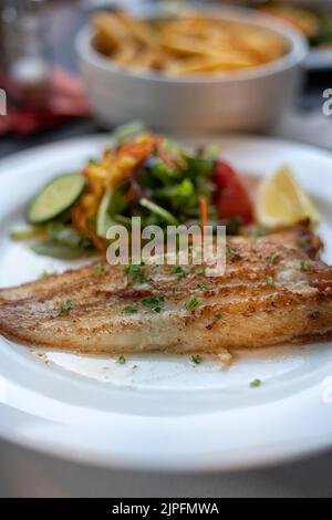 Plaice Fish Fillet with Salad Stock Photo - Alamy
