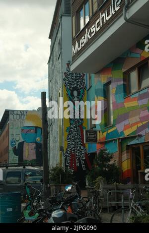 A vertical shot of a beautiful graffiti art in Hackescher Markt street ...