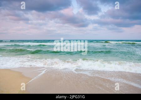 stormy weather in velvet season. seascape with clouds in evening light ...