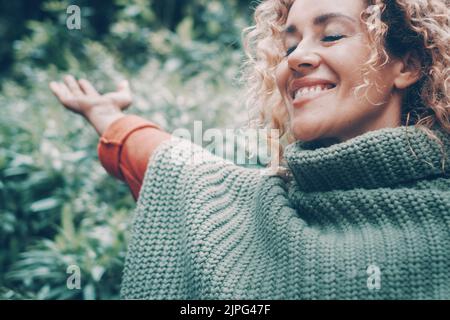 Young woman face opening eyes looking to camera. Pretty serious girl in ...