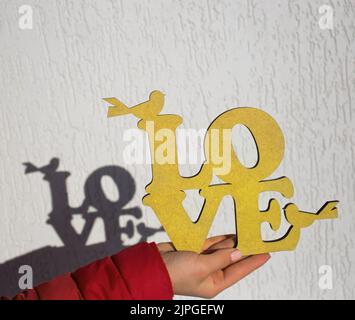 Yellow Valentine with inscription on wooden background Stock Photo - Alamy