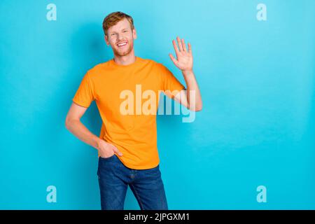 Photo of hooray red hair guy hold money wear orange t-shirt isolated on ...