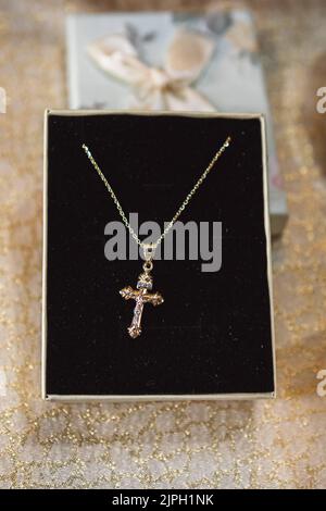 a cross in a box in a church during baptism Stock Photo - Alamy