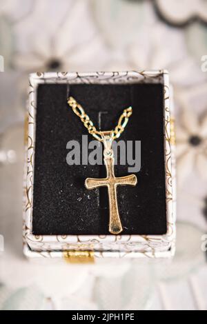 a cross in a box in a church during baptism Stock Photo - Alamy