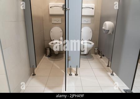 Open Toilet Door of Public Restroom with a Gender Inclusive Sign Stock ...