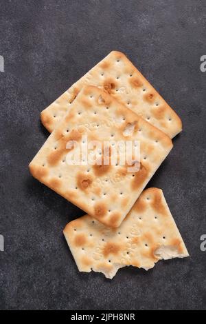 broken cream crackers Stock Photo - Alamy