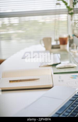 Office workplace - empty notepad, pen, pencil, ruler, compass on dark ...