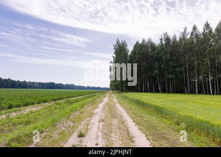 unpaved highway in rural areas, part of the road for cars without ...