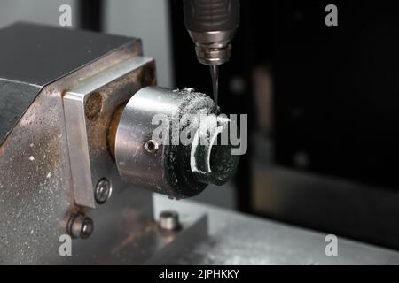 Modern jewelry technology. Cnc machine cuts out green wax ring ...
