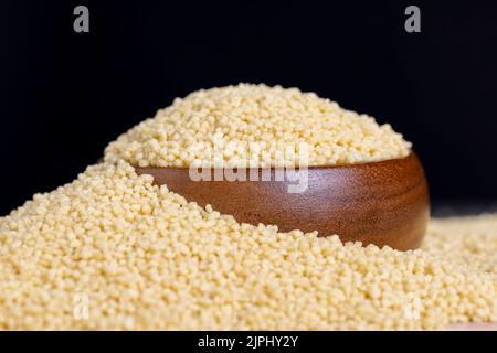 Fresh raw porridge couscous from wheat or millet, cooking dishes from ...