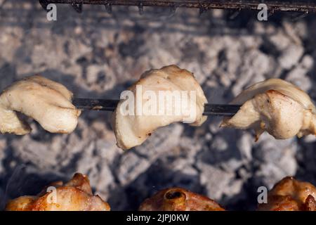 A fire made of logs while cooking barbecue on vacation at the weekend ...