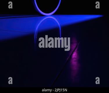 light rings, pink and blue, magenta and turquoise with reflections on ...