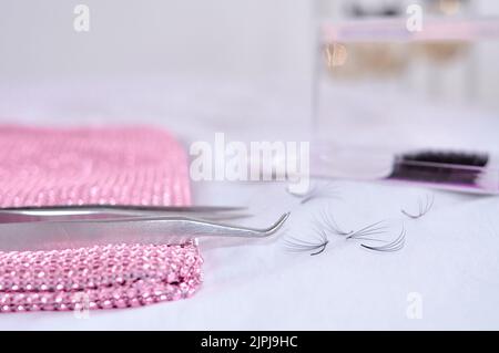 Bunches of fake lashes fell down after eyelash extensions, beauty salon ...