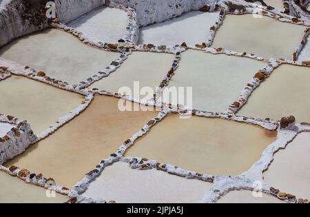 A beautiful shot of salt pools in the Salt Mines of Maras in Peru Stock ...
