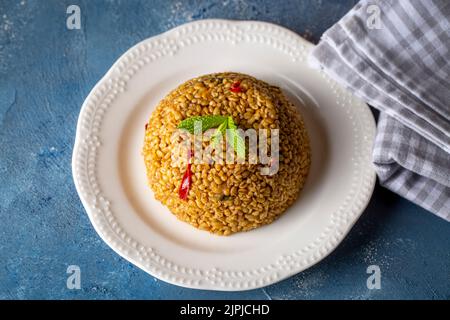 Bulgur pilaf with Siyez wheat and vegetables Stock Photo - Alamy