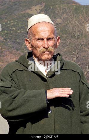 Portrait of an old Albanian peasant muslim woman wearing a white ...